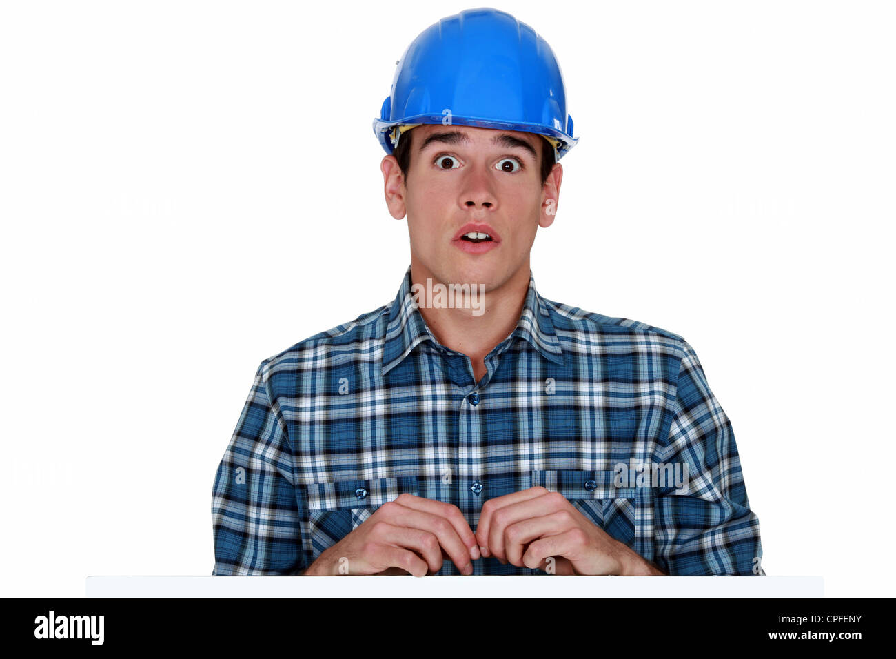 Confused young builder Stock Photo - Alamy