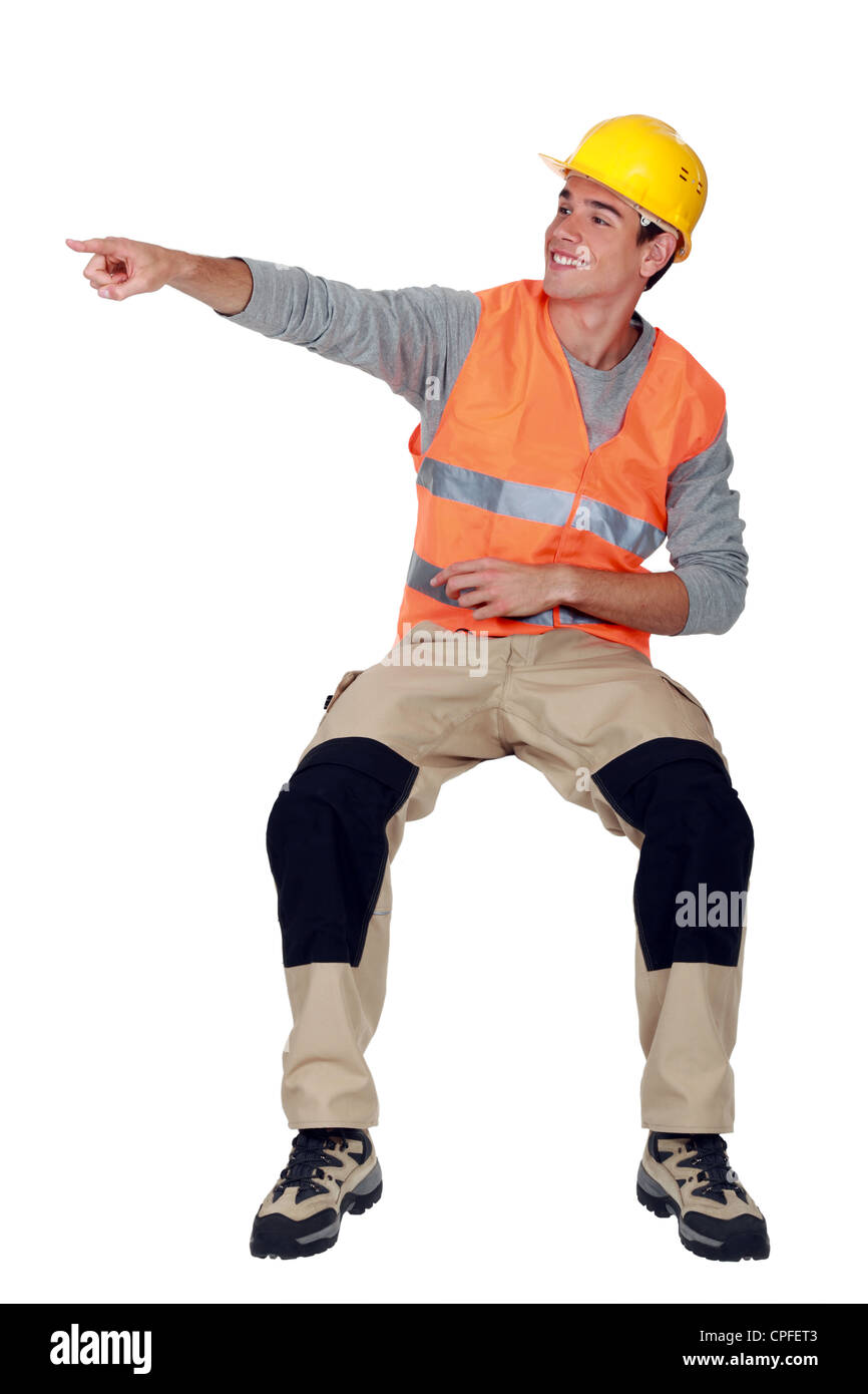 A construction worker pointing at a direction Stock Photo - Alamy