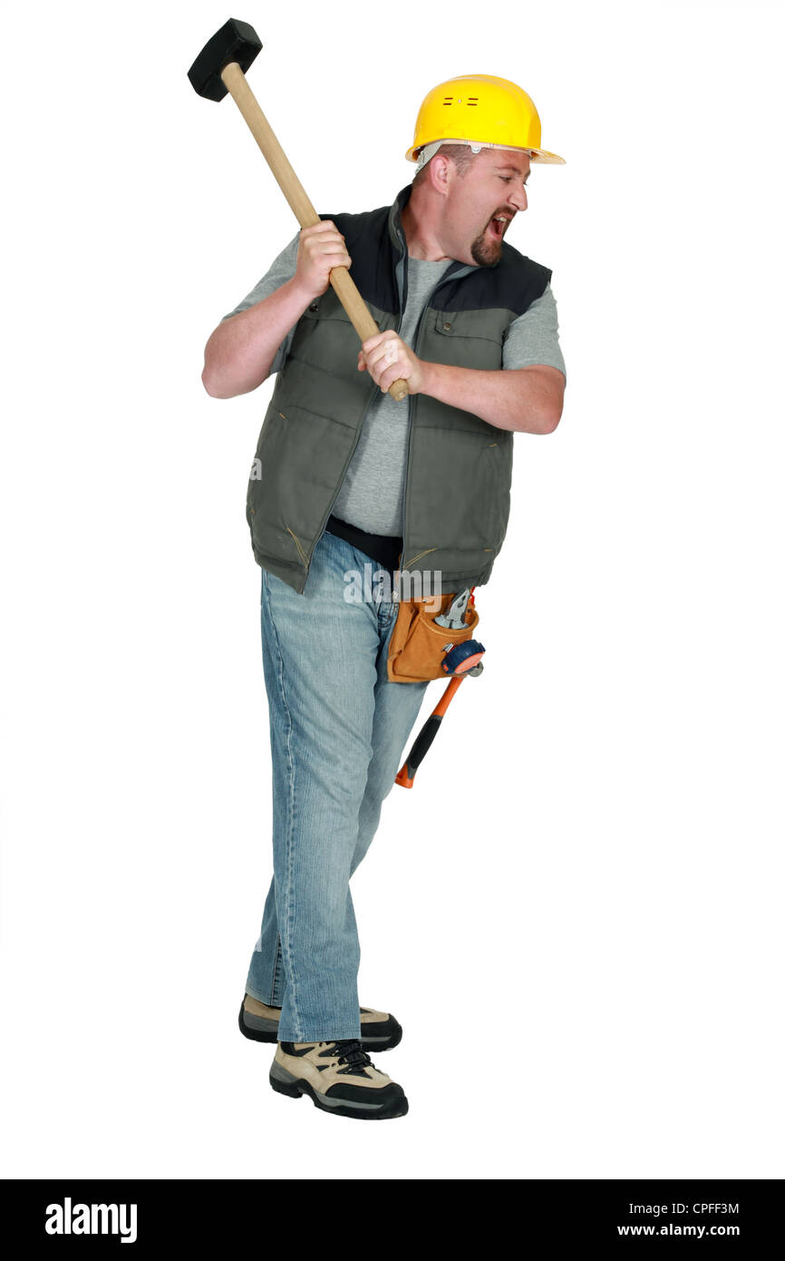 Man with hammer hitting Stock Photo - Alamy