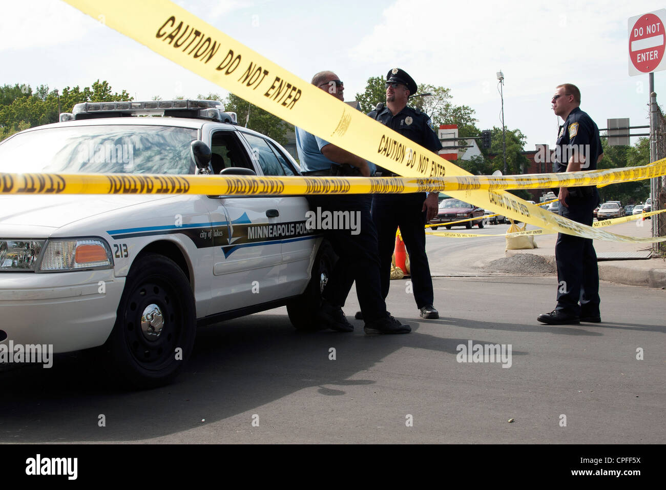 Police keeping guard at the closed ramp to the collapsed 35W bridge ...