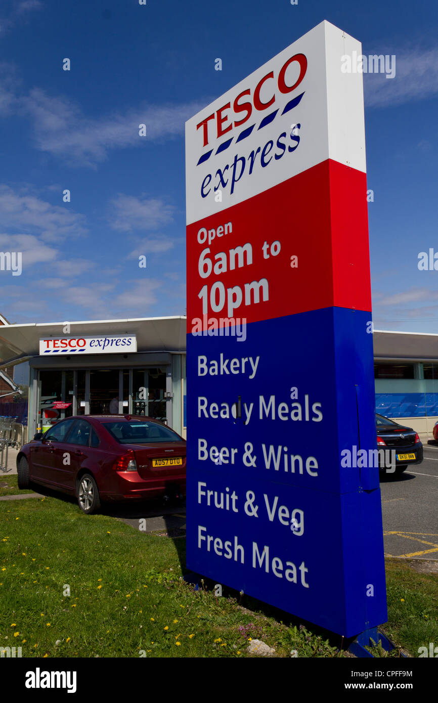 A large sign outside a Tesco Express Stock Photo - Alamy