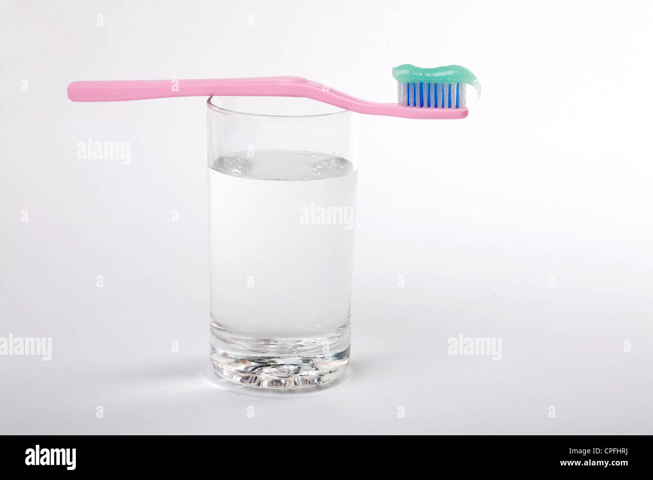 toothbrush and a glass of water Stock Photo - Alamy