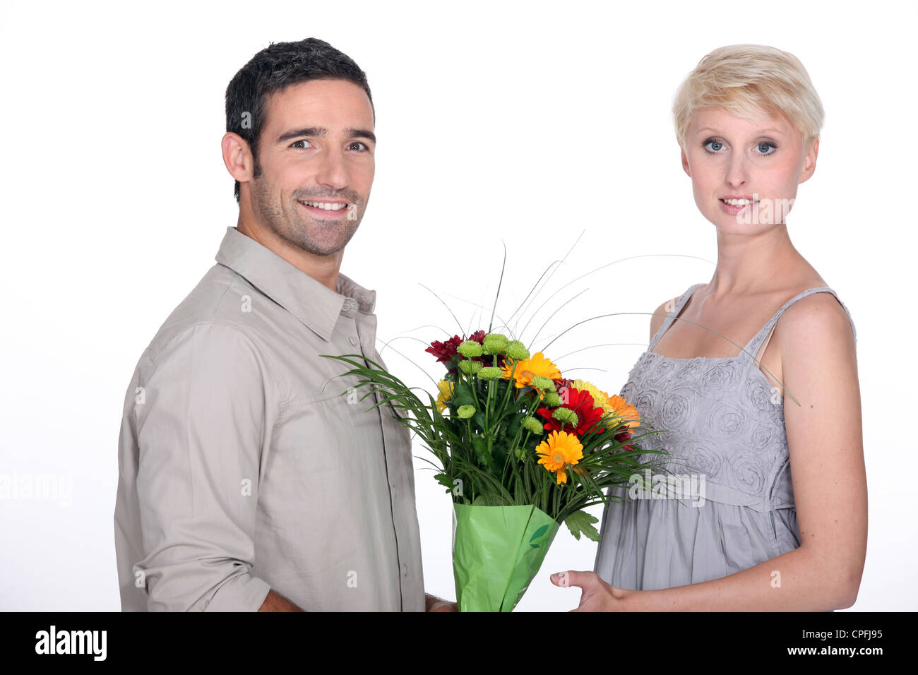 Man giving flowers Stock Photo - Alamy