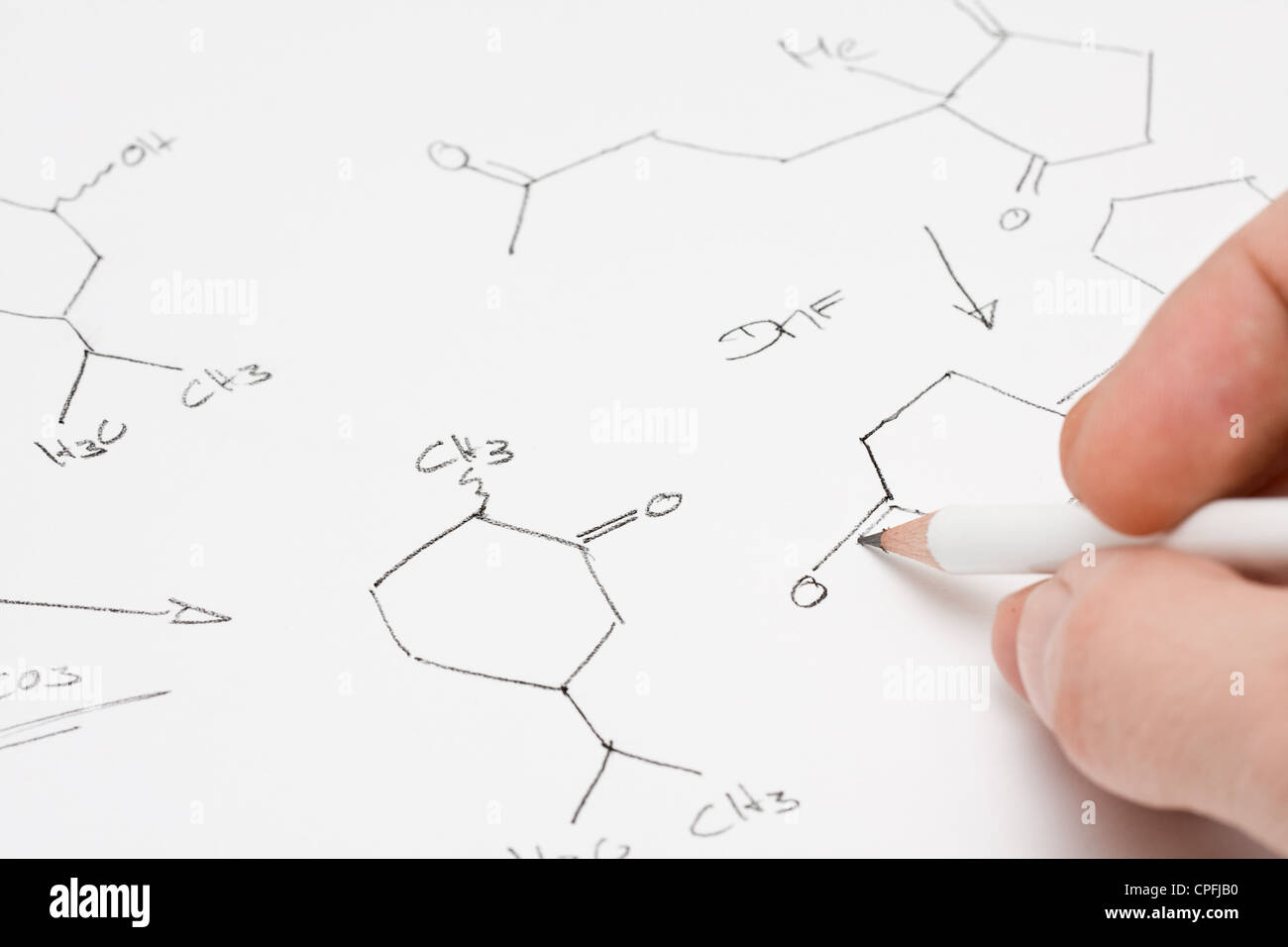 Researcher or teacher writing chemical formula on paper Stock Photo - Alamy