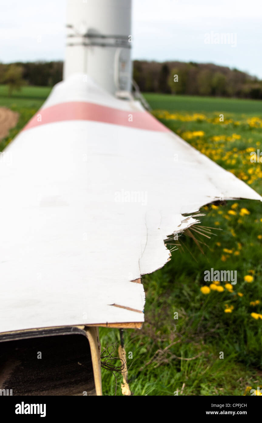 alternative energy source. wind turbine with broken spare rotor blade ...