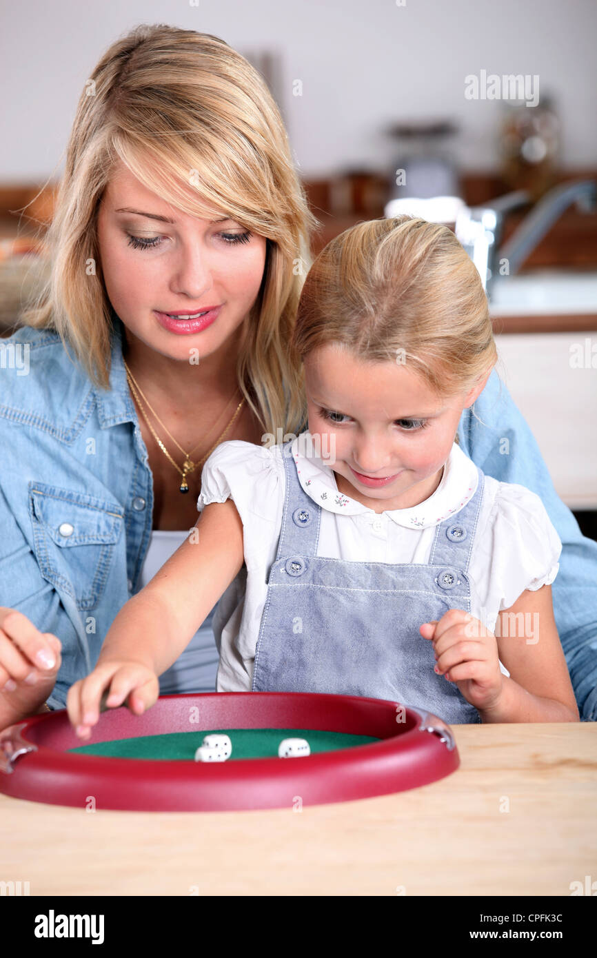 Mother and daughter playing a game Stock Photo - Alamy
