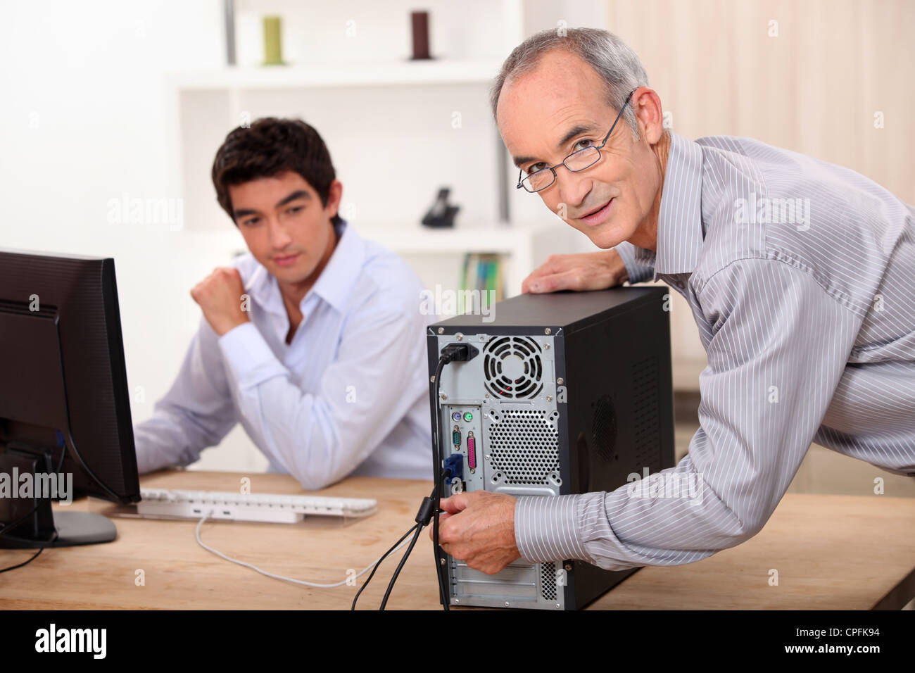 Man fixing a computer Stock Photo - Alamy