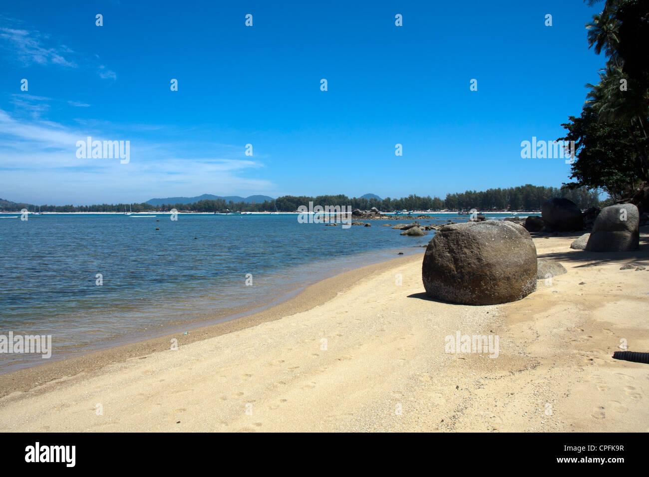 Large rock on Bang Tao Beach, Phuket, Thailand Stock Photo - Alamy