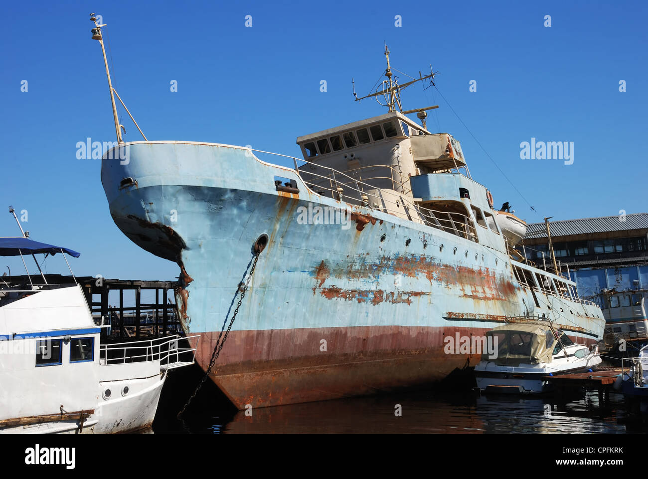 old rusty ship yacht and cutters in the port Stock Photo - Alamy