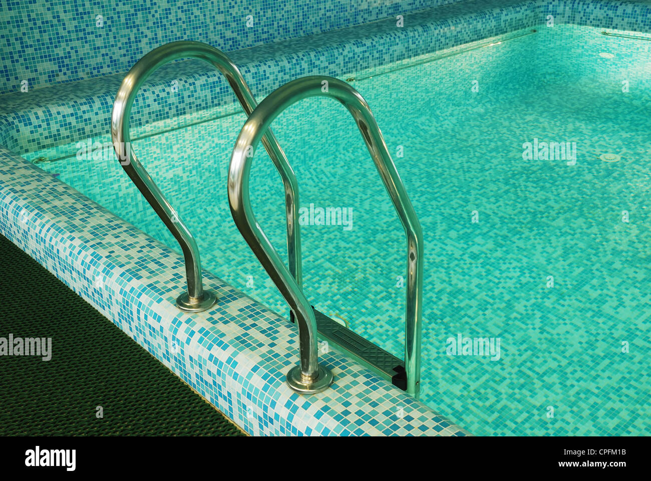 fine swimming pool with ladder indoor horizontal Stock Photo - Alamy