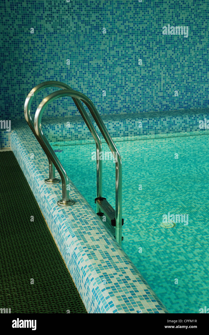 fine swimming pool with ladder indoor vertical Stock Photo - Alamy