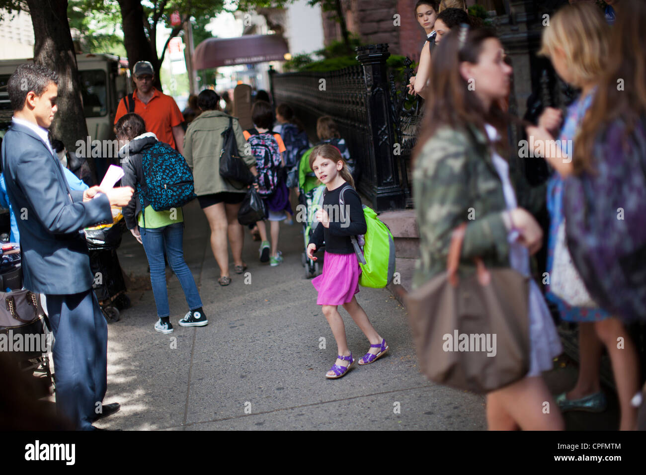 Students exit The Packer Collegiate Institute at the end of a school ...