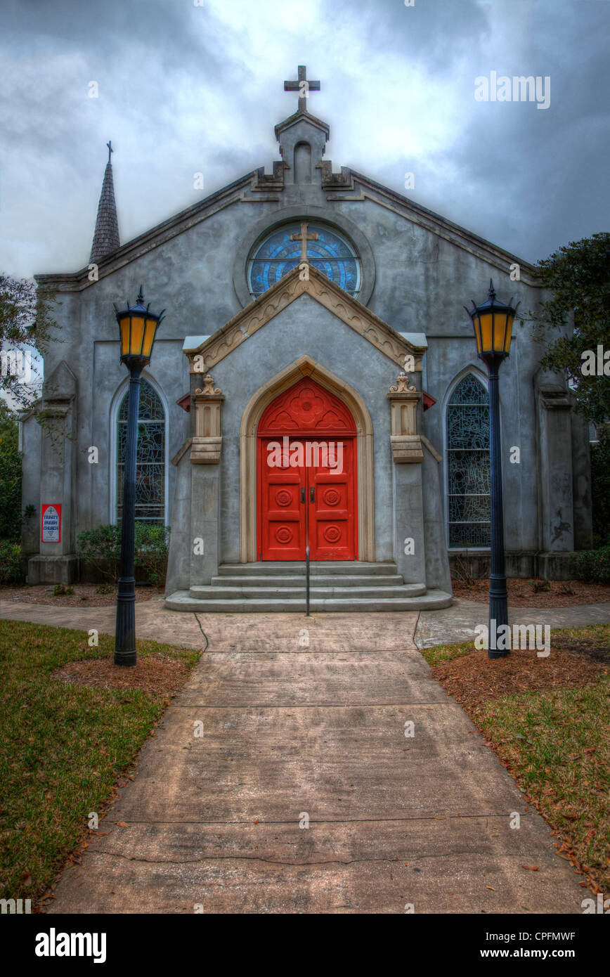 The front view of a church with a red door Stock Photo - Alamy