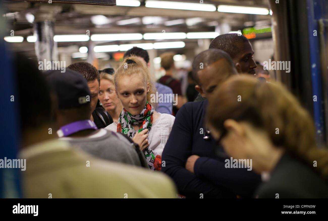 Commuters on the New York City subway system wait for a train Stock ...