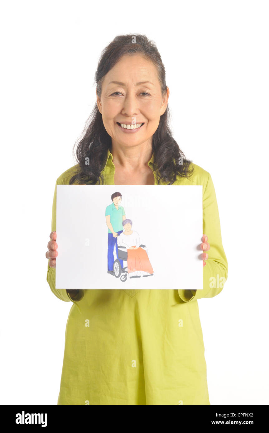 Senior woman showing board of nursing care Stock Photo - Alamy