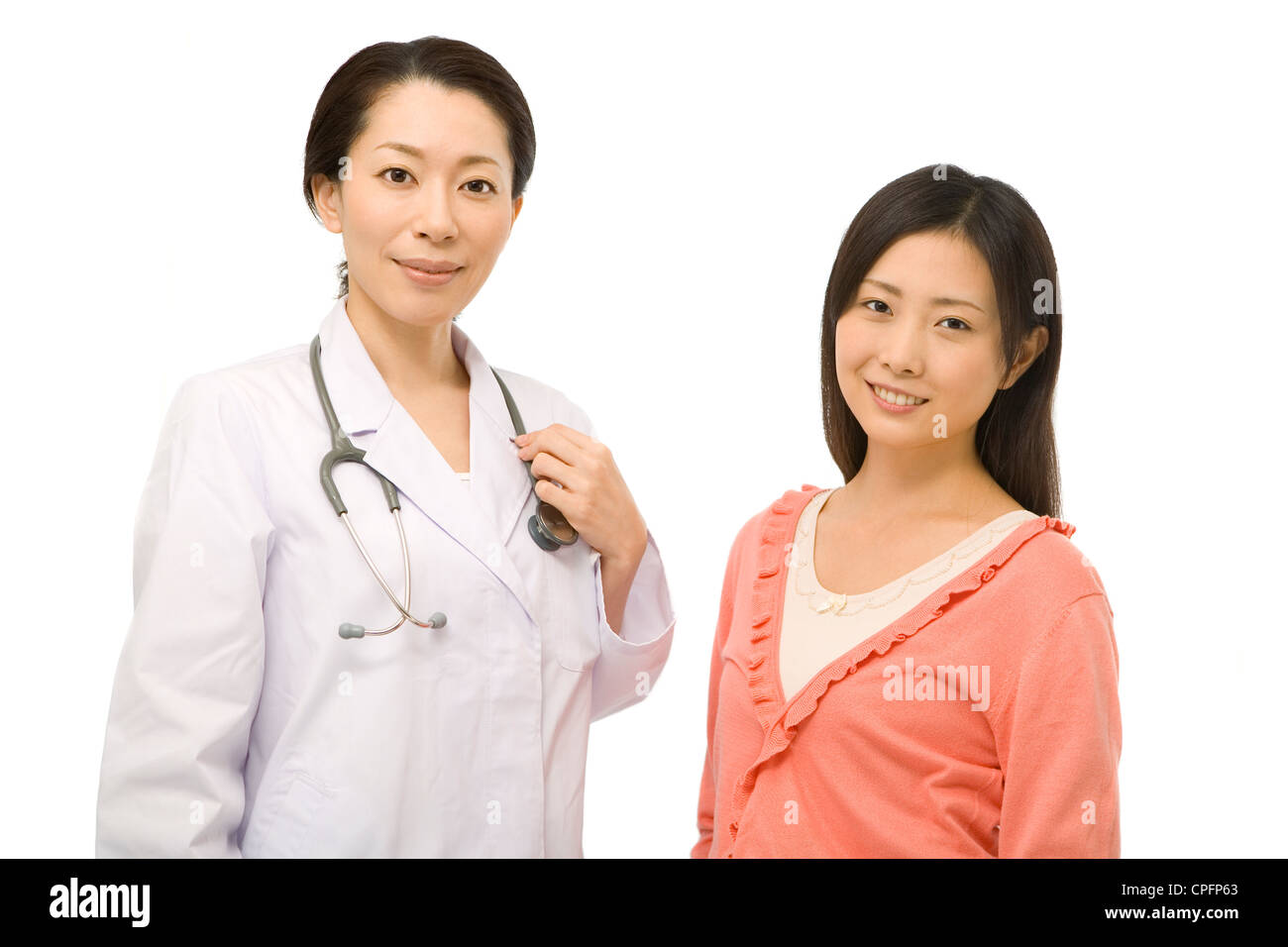 Female doctor and young woman Stock Photo - Alamy