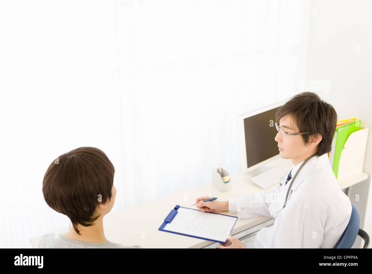 Doctor talking to patient Stock Photo - Alamy