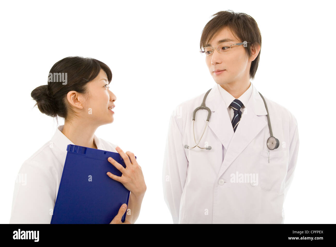 Doctor talking nurse Cut Out Stock Images & Pictures - Alamy