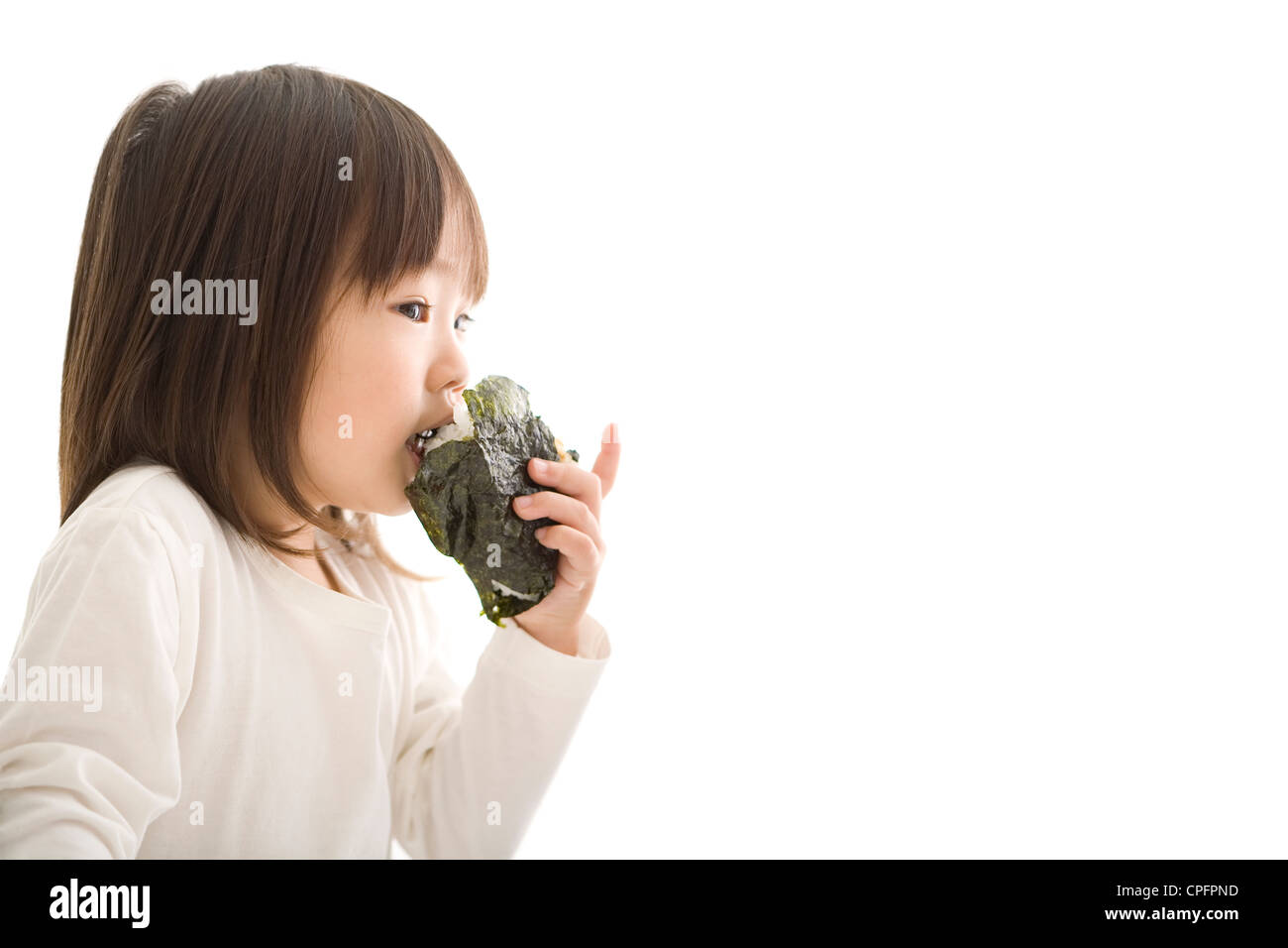 Boy eating rice ball Stock Photo - Alamy