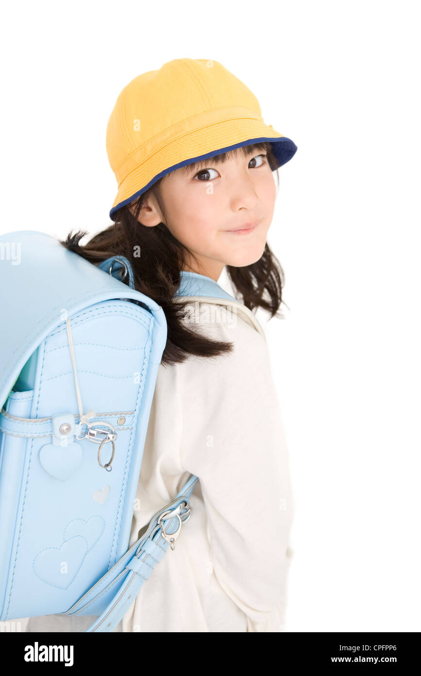 Girl carrying school satchel on back Stock Photo - Alamy