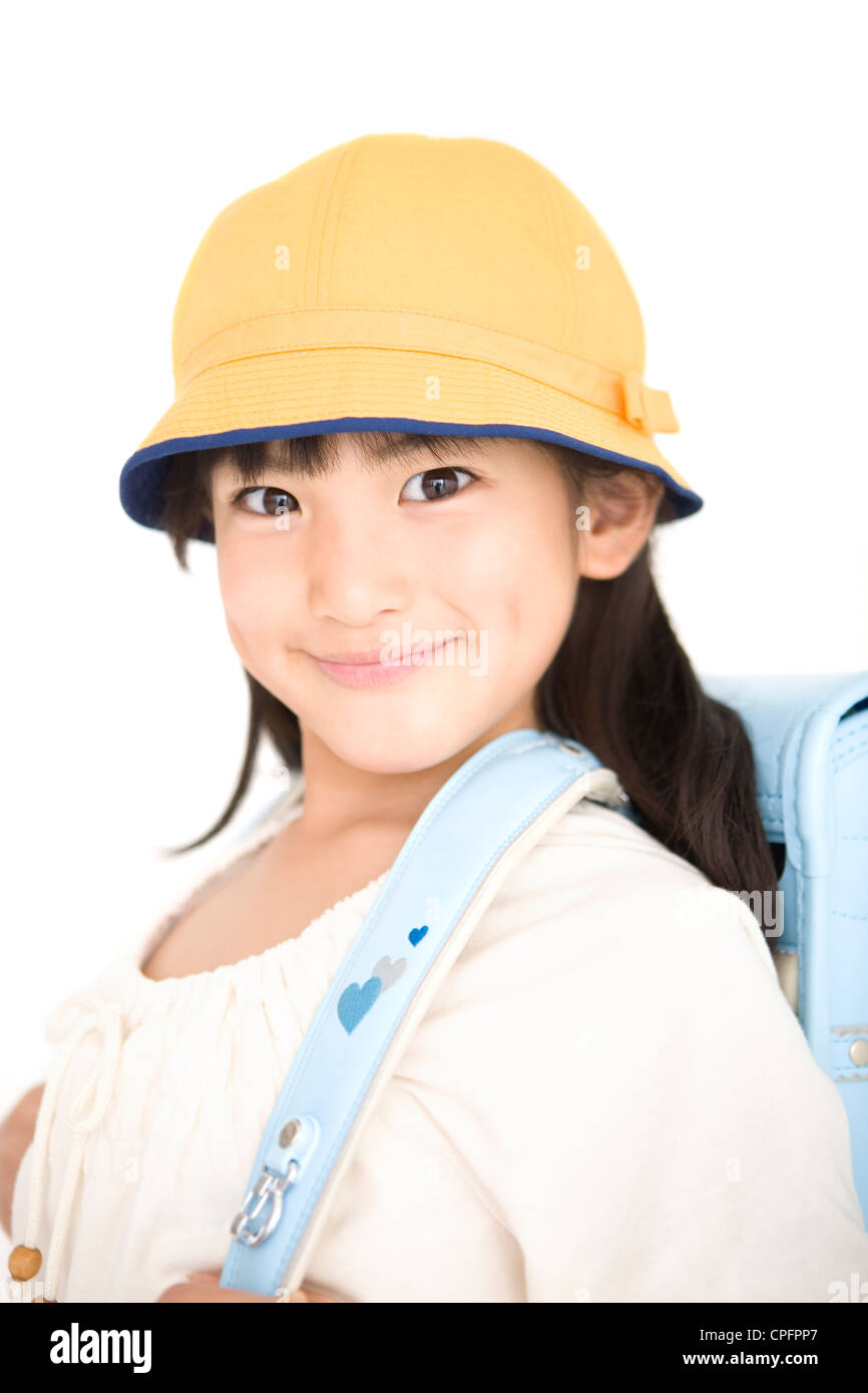 Girl carrying school satchel on back Stock Photo - Alamy