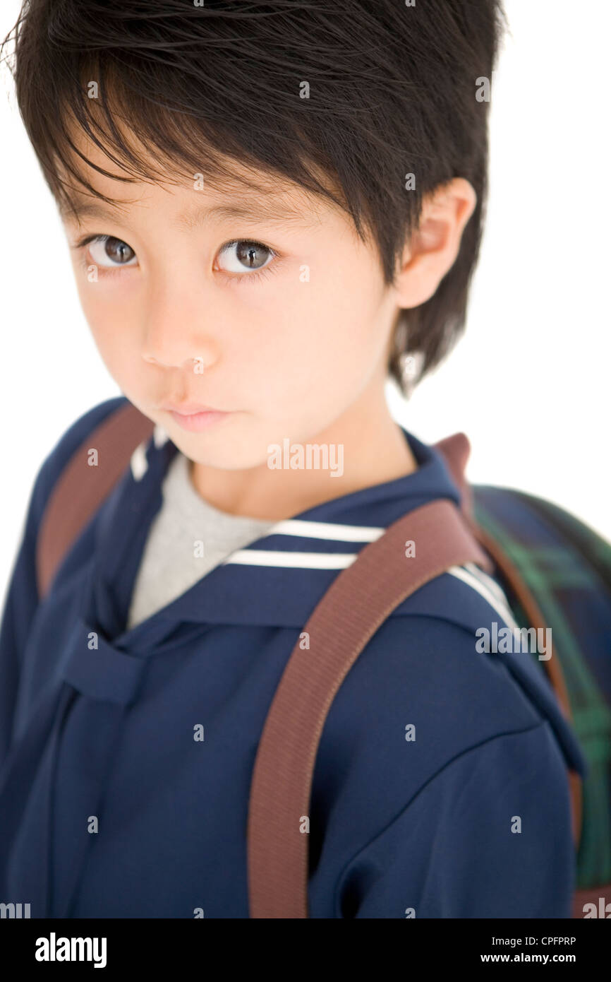 Boy carrying school satchel on back Stock Photo - Alamy