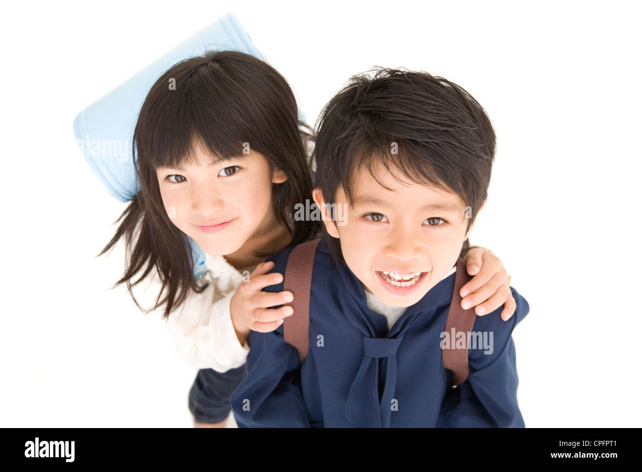 Girl holding boy's shoulder Stock Photo - Alamy