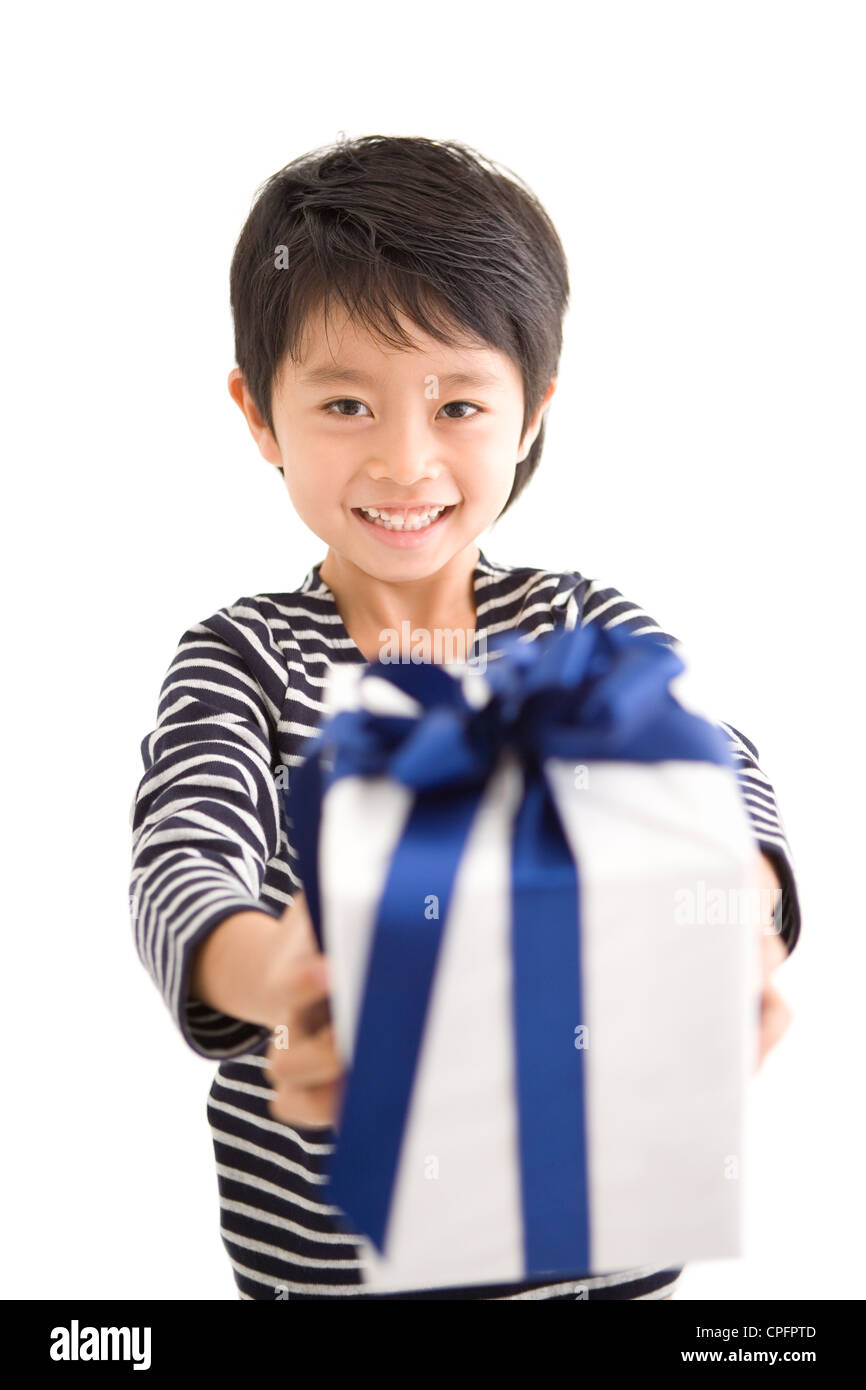 Boy holding out gift box Stock Photo - Alamy