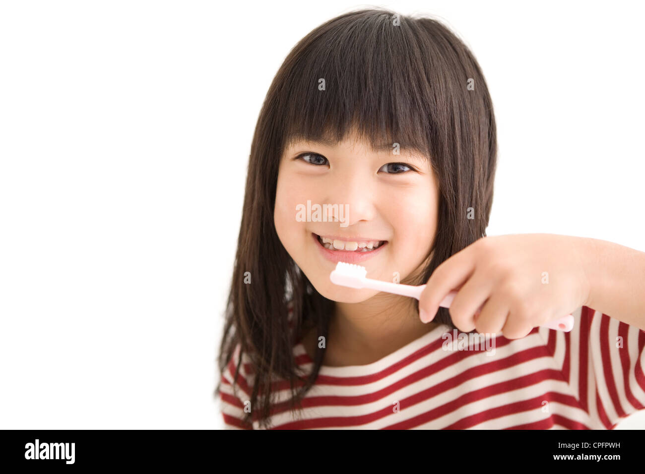 Girl holding toothbrush Stock Photo - Alamy