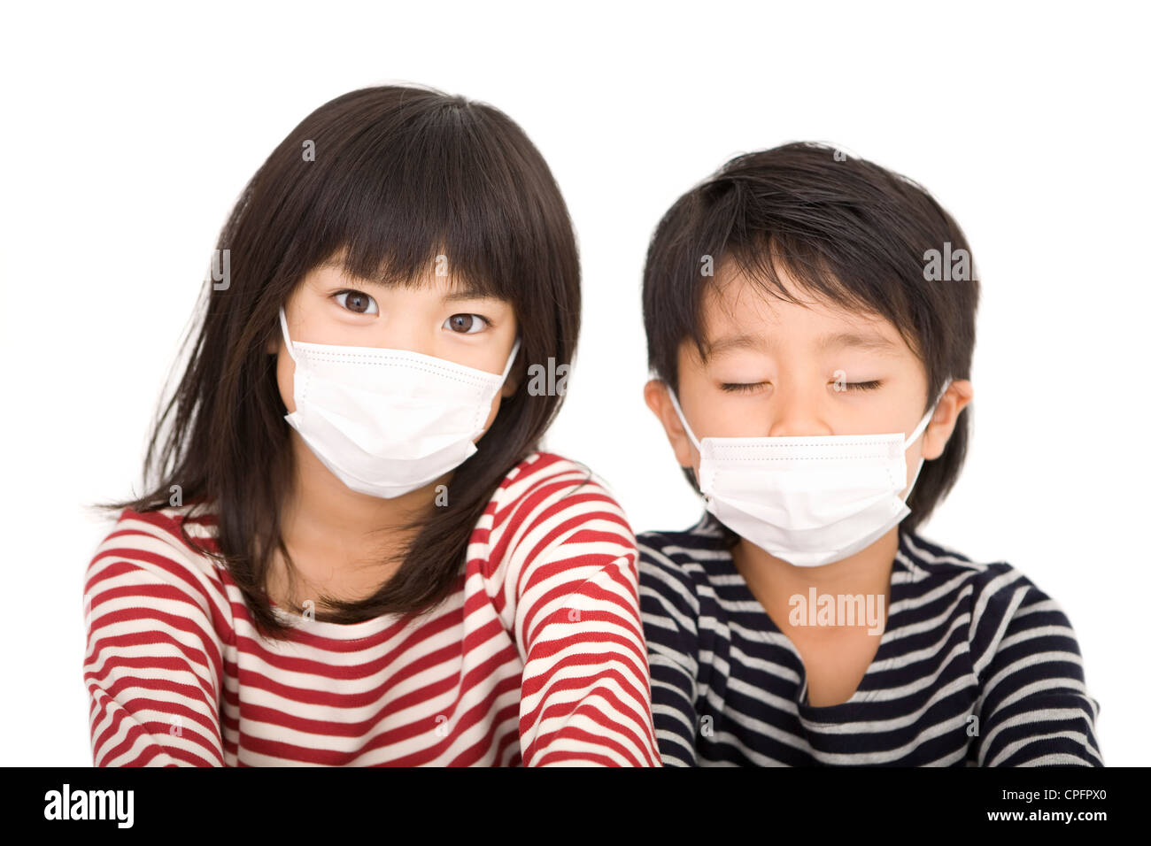 Boy and girl wearing mask Stock Photo - Alamy
