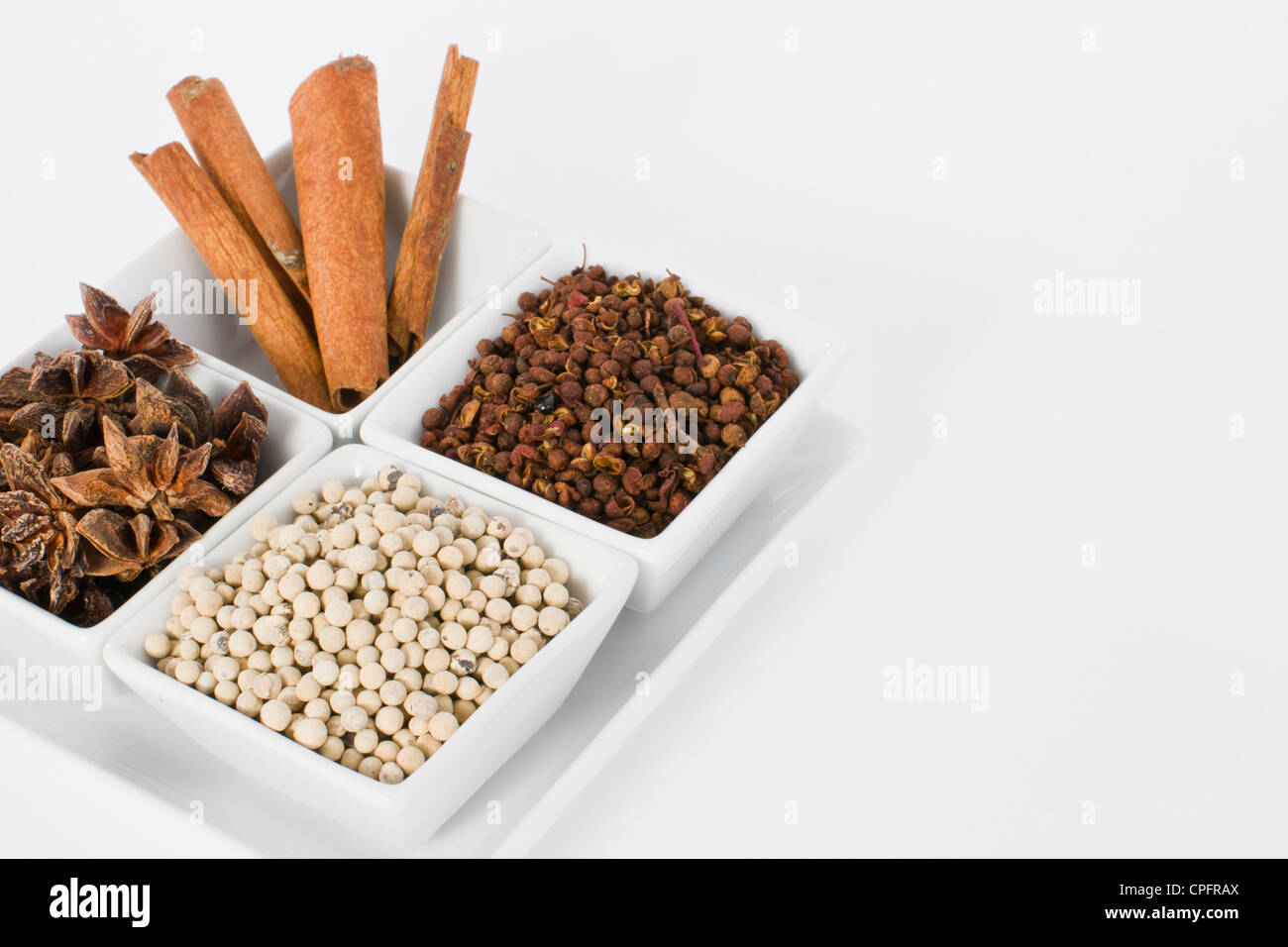 Star Anise, Cinnamon, White Pepper and Coriander Seed in Ceramic Bowl ...