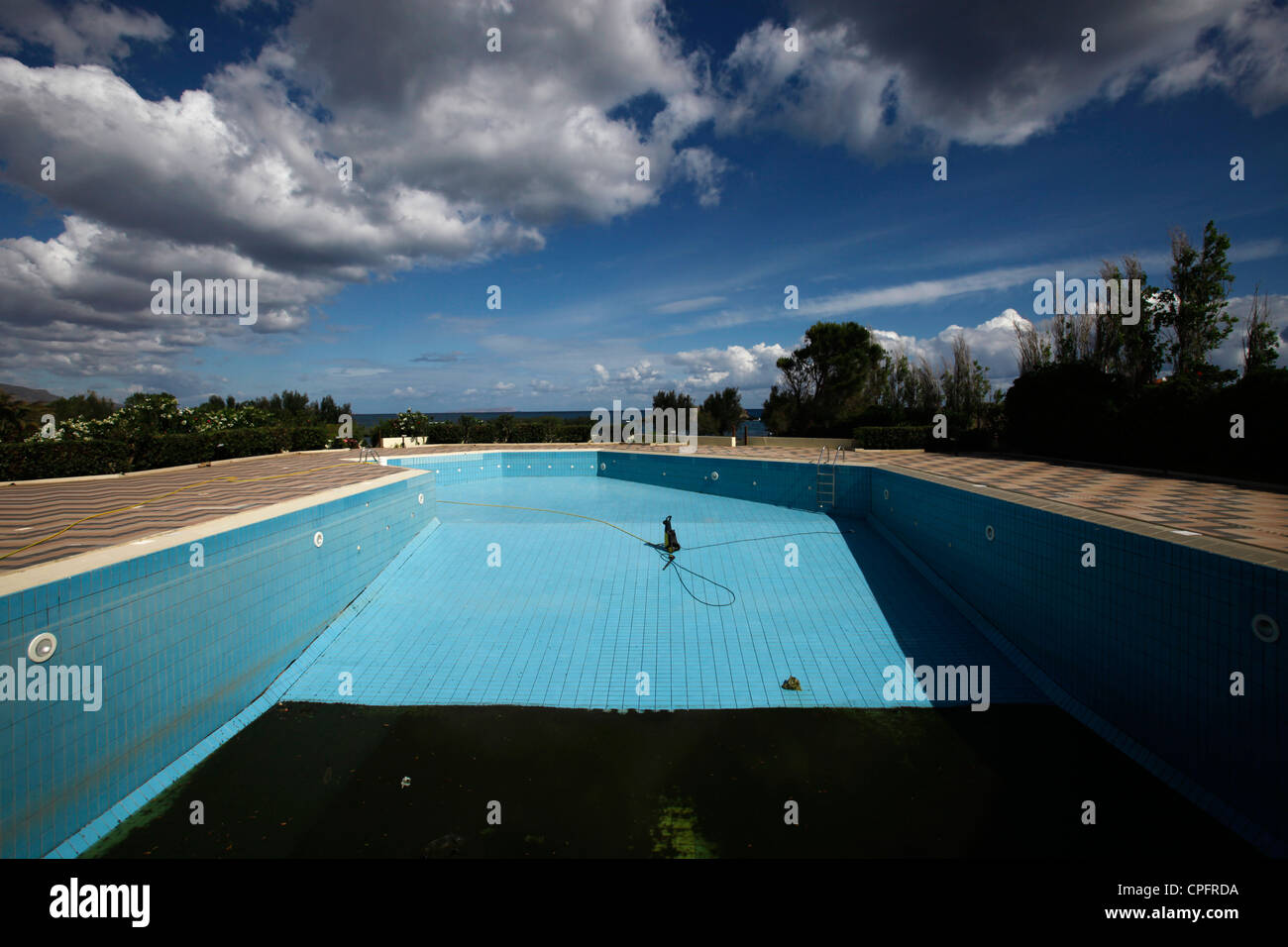 Empty swimming pool of Meli Palace hotel near the coastal town of Agios ...