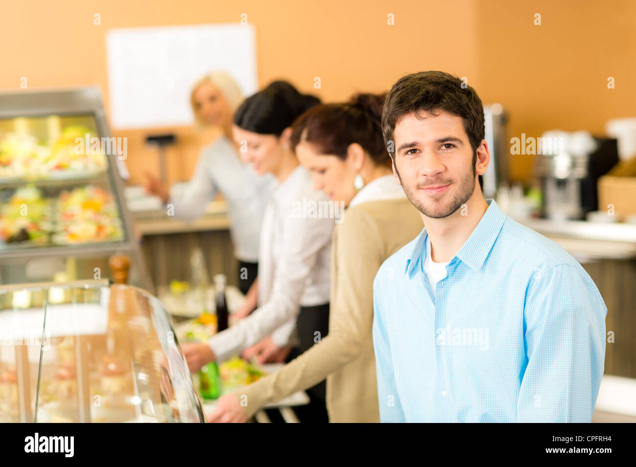 Business man take cafeteria lunch food from display cabinet self ...