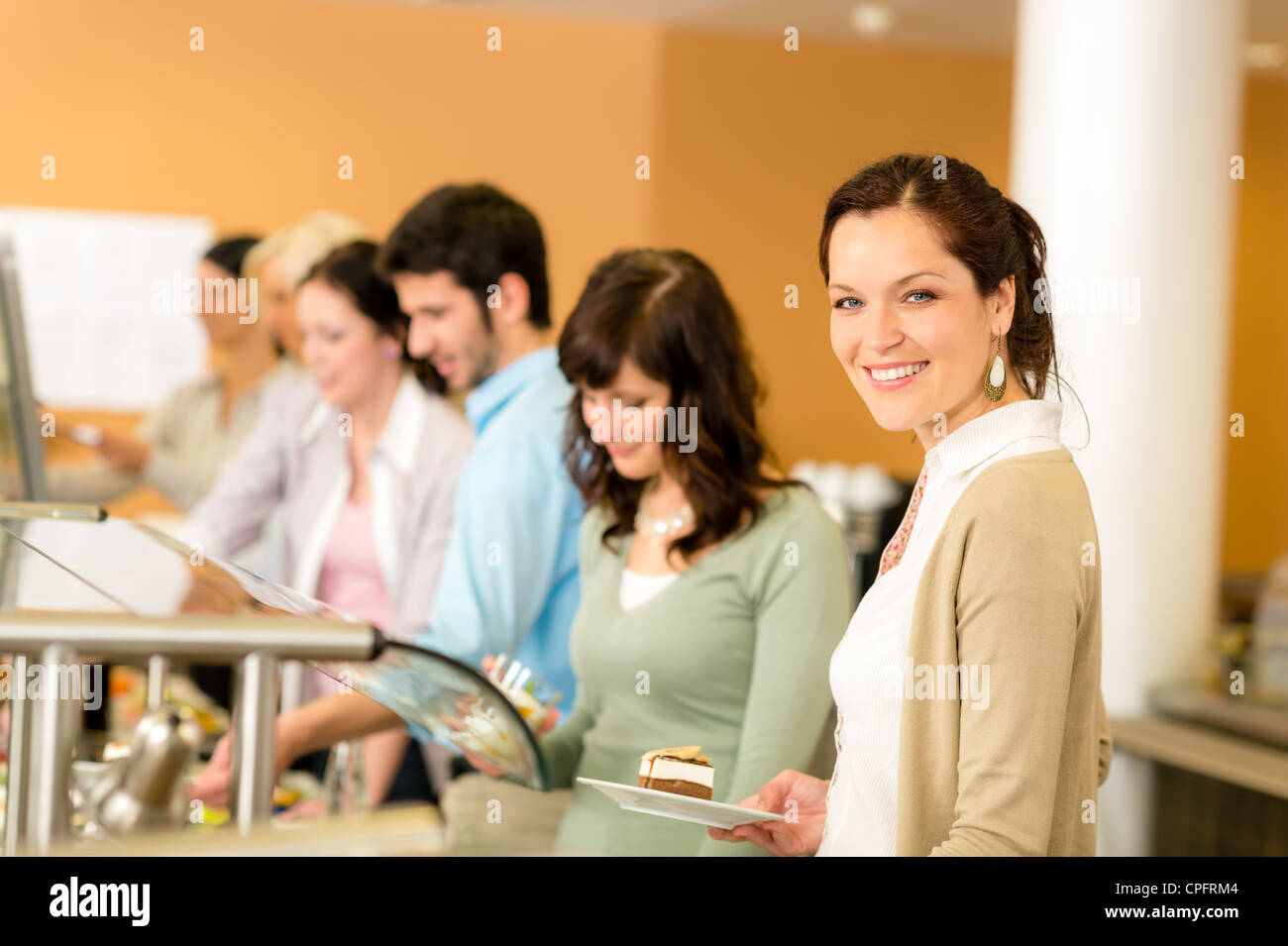 Young women choose food buffet hi-res stock photography and images - Alamy