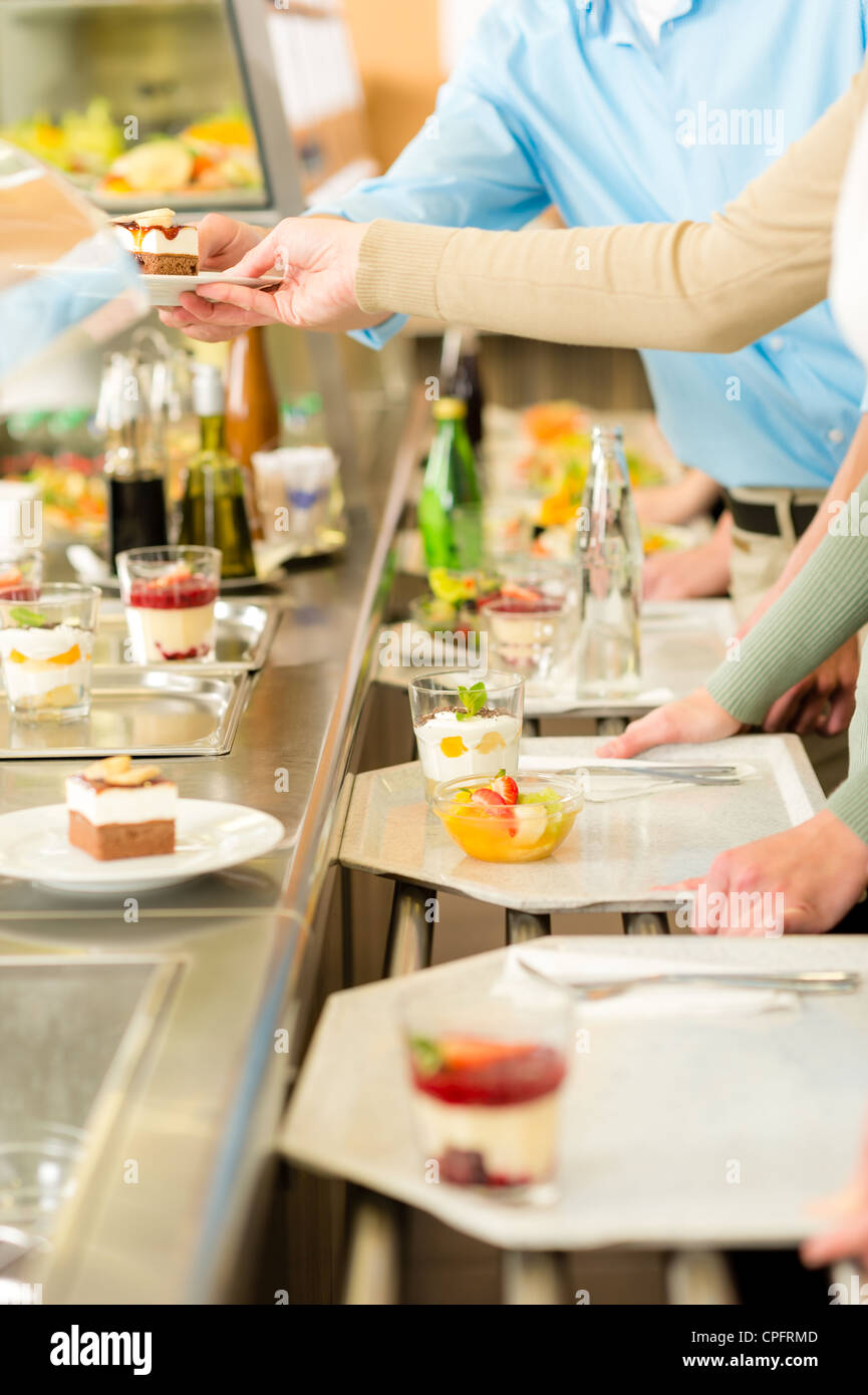 Desserts at cafeteria people with serving tray self service canteen ...