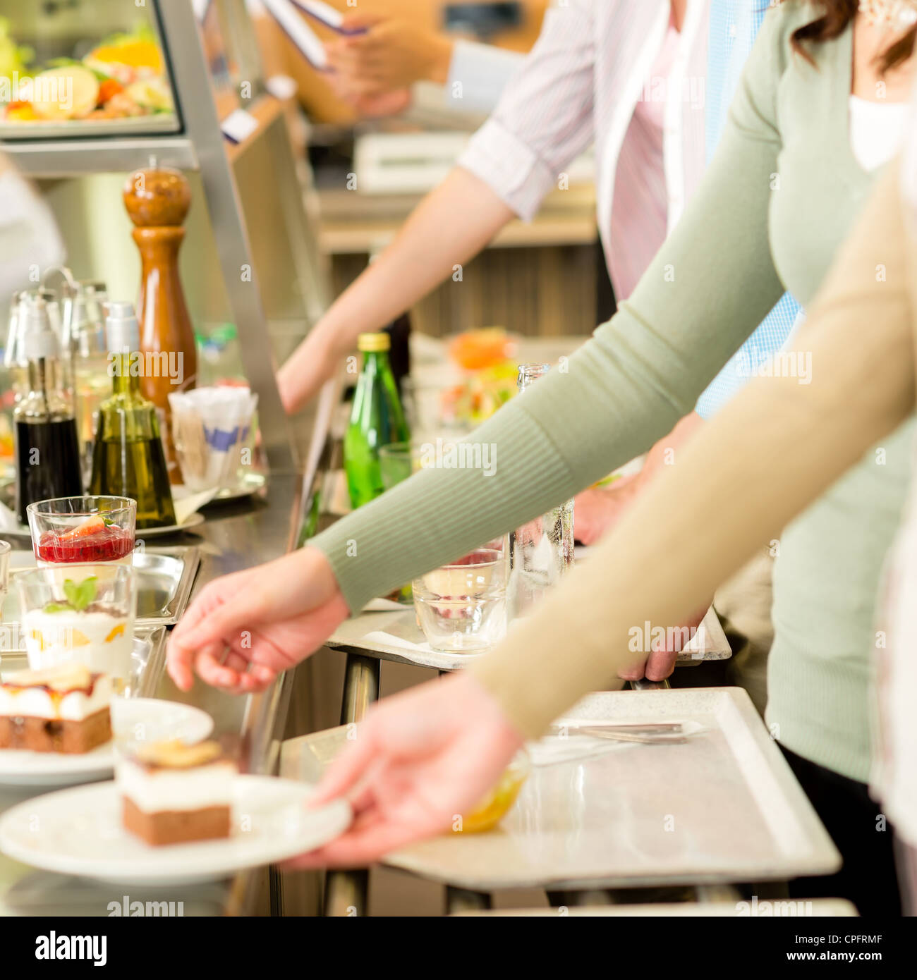 Desserts at cafeteria people with serving tray self service canteen ...