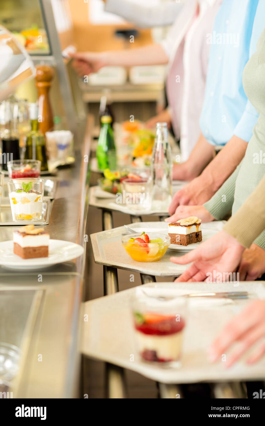 Desserts at cafeteria people with serving tray self service canteen ...