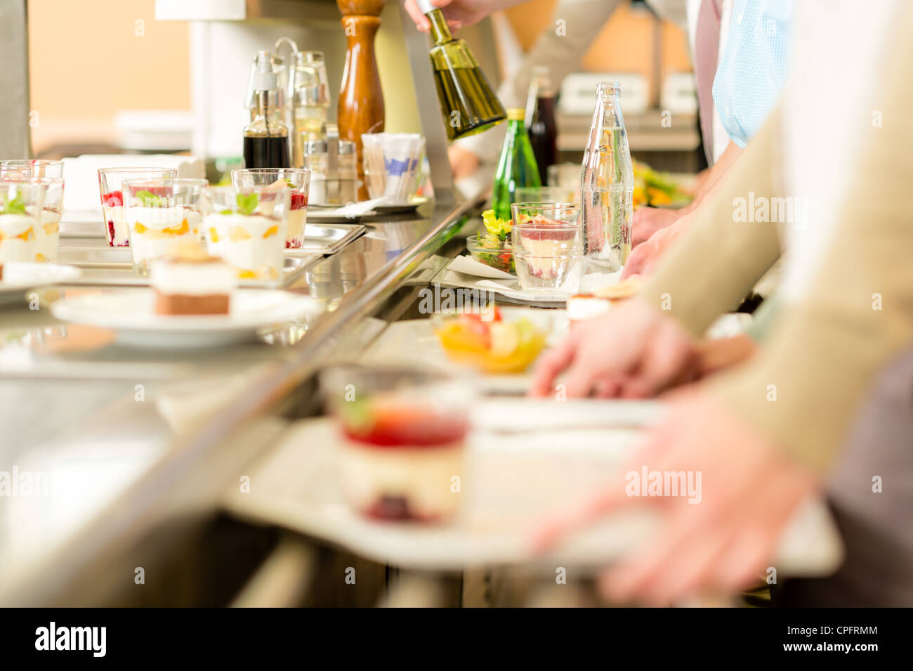 Desserts at cafeteria people with serving tray self service canteen ...