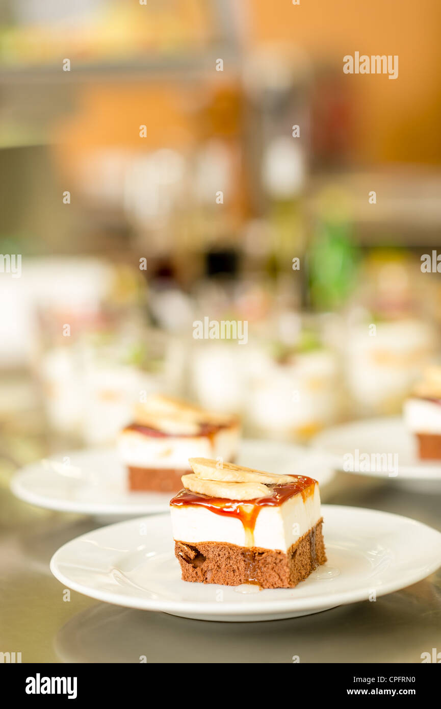 Banana dessert on white plate in cafeteria canteen delicious cake Stock ...