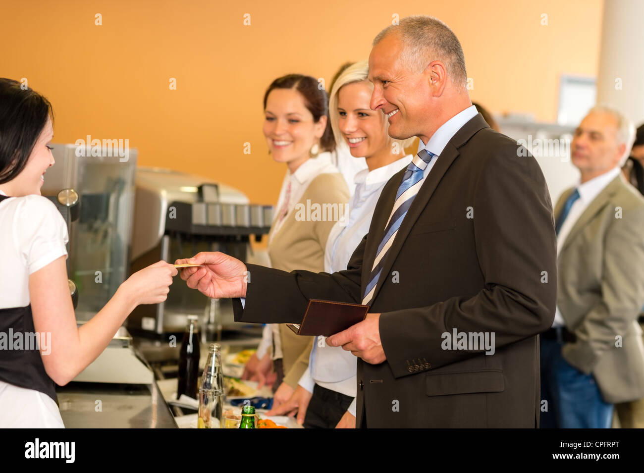 Cafeteria man pay by credit card cashier food on serving tray Stock ...