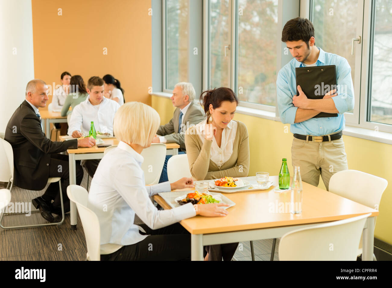 Lunch break office colleagues eat meal in cafeteria fresh salad Stock ...