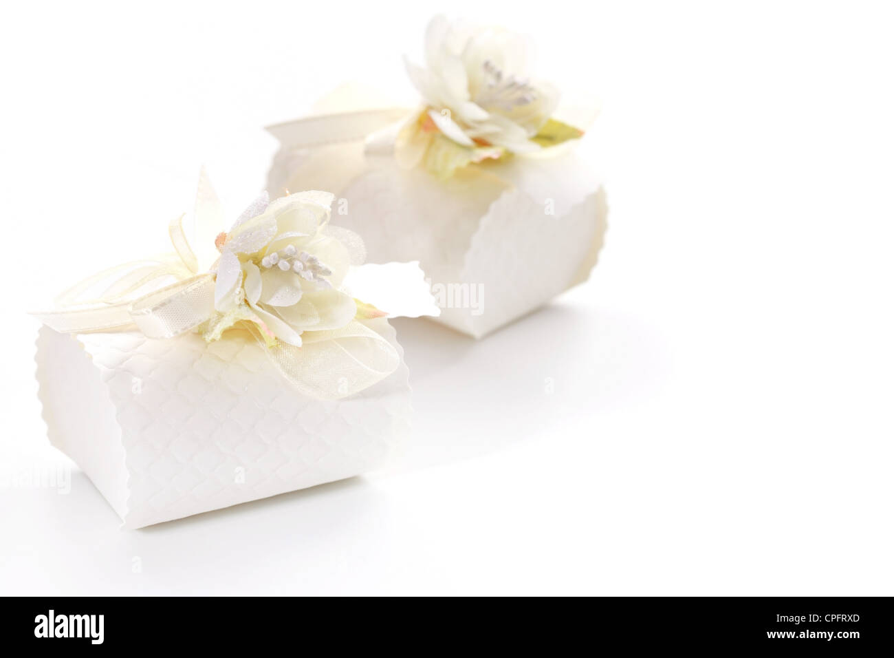 Small present box decorated with flower in white Stock Photo - Alamy