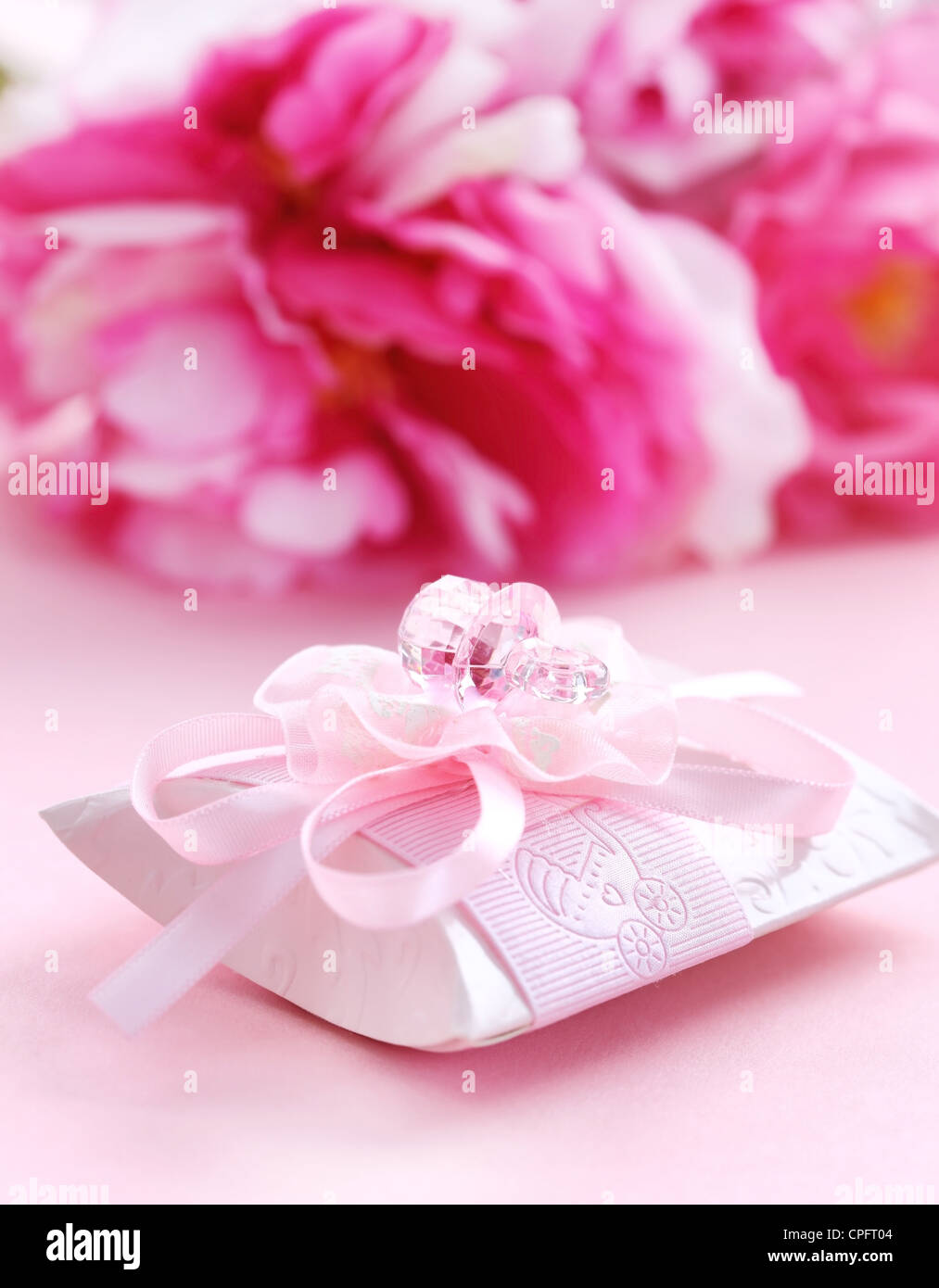 Pink present box with pacifier for baby girl Stock Photo - Alamy
