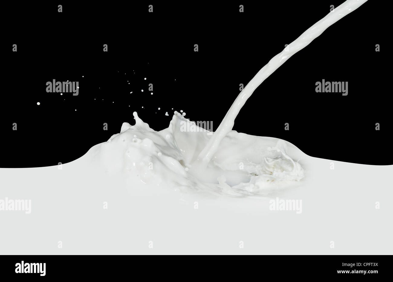 splashing milk isolated on black background Stock Photo - Alamy