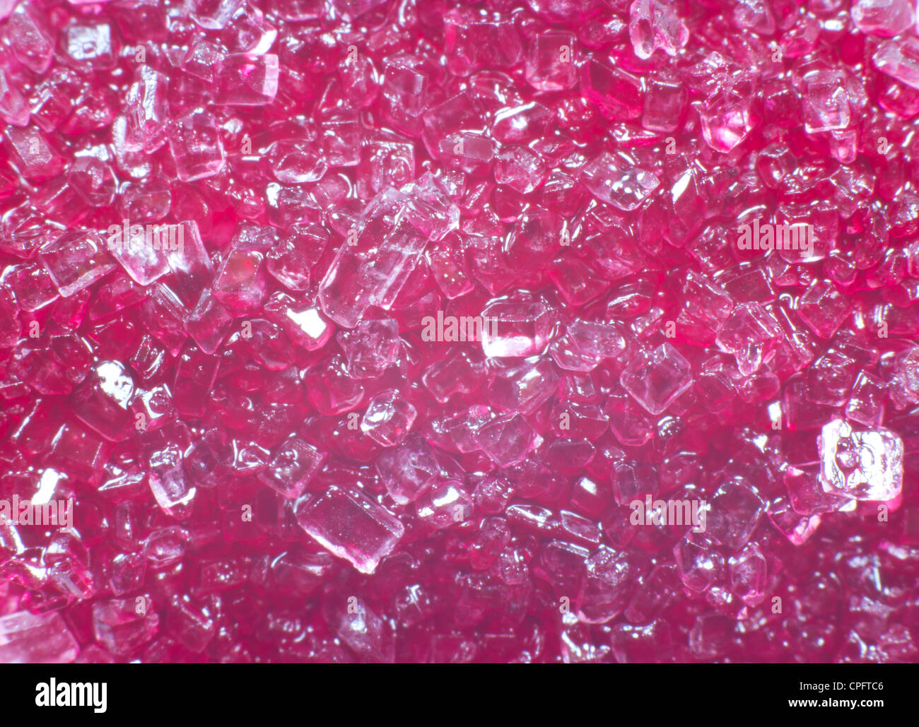 A macro picture of white sugar colored with pink color Stock Photo - Alamy