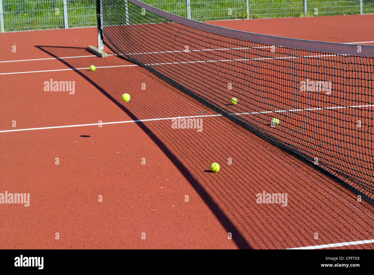 tennis balls with net Stock Photo - Alamy