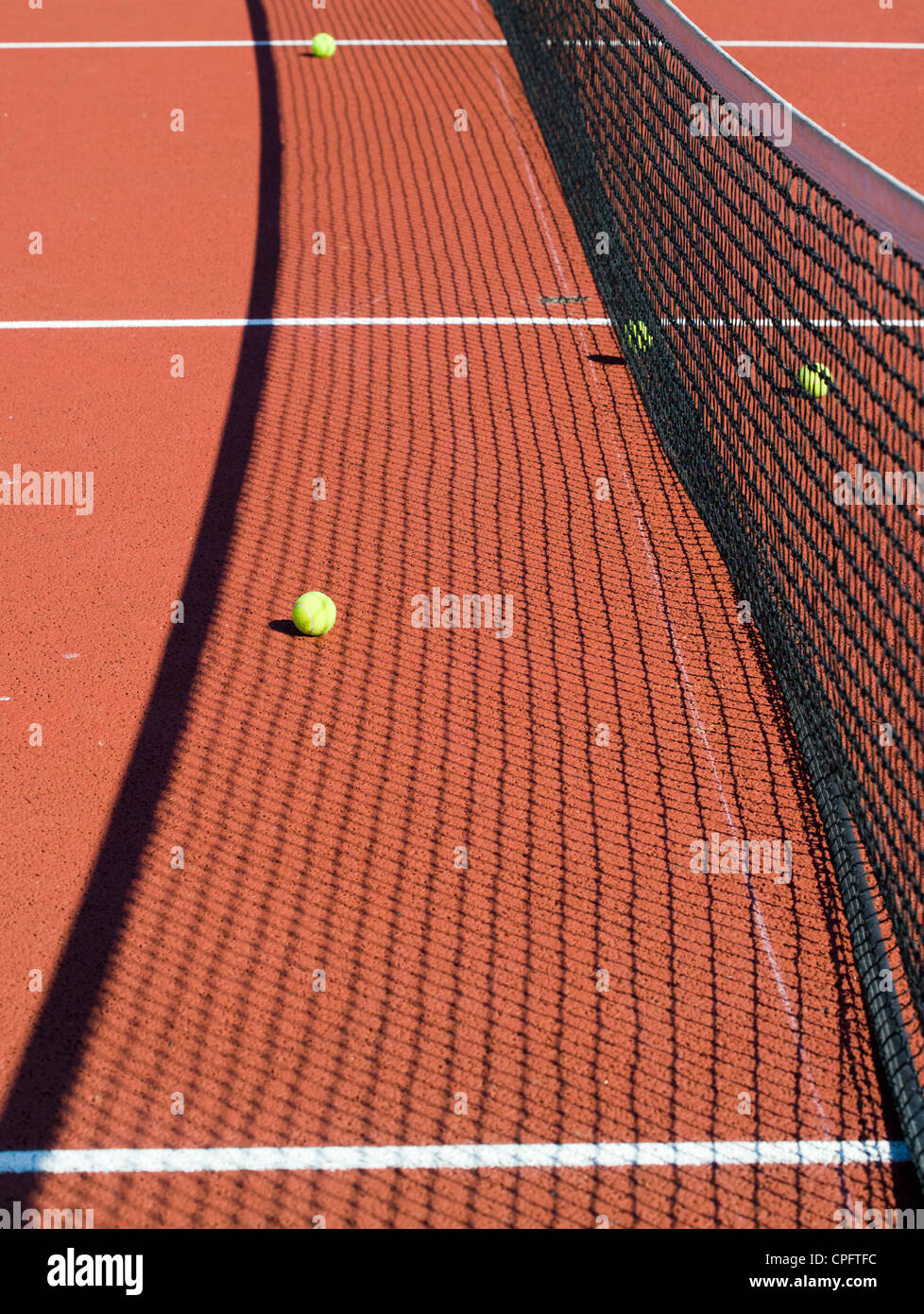 tennis balls with net Stock Photo - Alamy