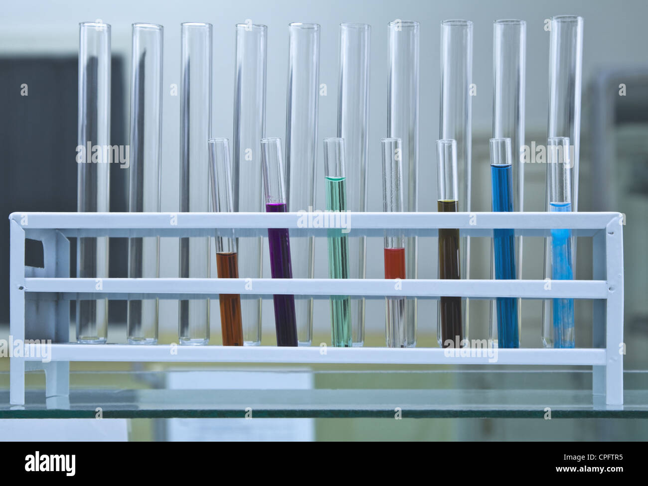 Test tubes in a rack,some of them containing colorful solutions Stock ...