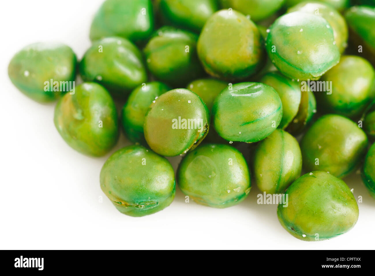 dried salted green peas on white background Stock Photo - Alamy