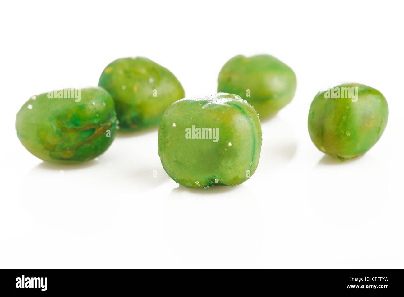 dried salted green peas on white background Stock Photo - Alamy